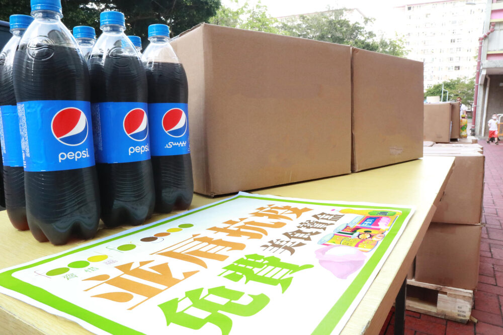 Distributed food parcel boxes and Pepsi to residents at Lai Kok estate ...